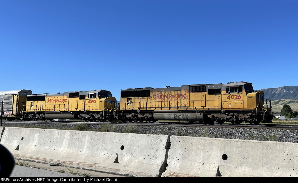 UP 4026 4592 (both SD70M) lead a westbound autorack train between Peterson and Morgan Utah ...